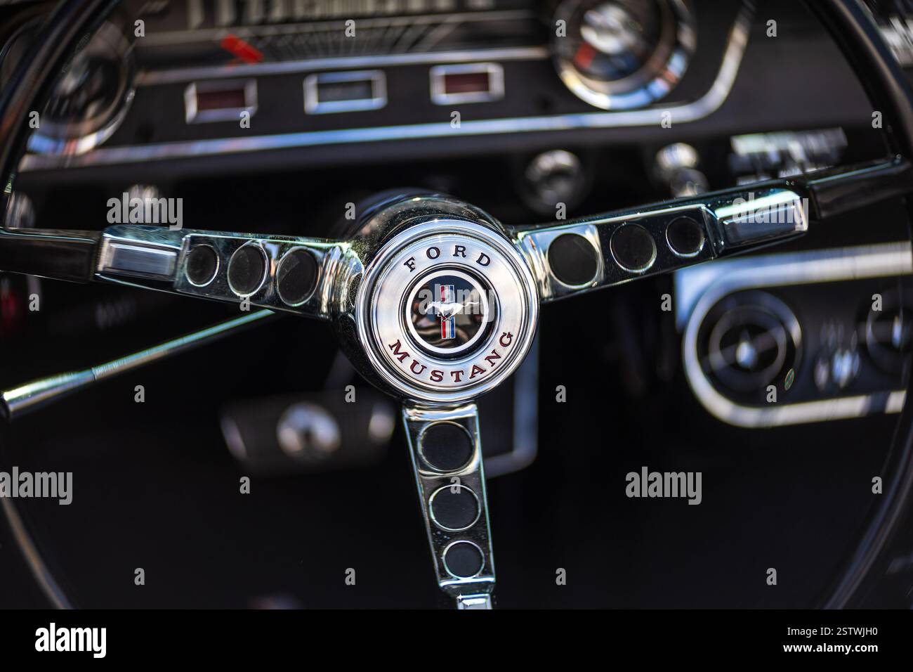 The interior of muscle car Ford Mustang, 1965. Swirl bokeh. Art lens. Die Oldtimer Show 2023 ...