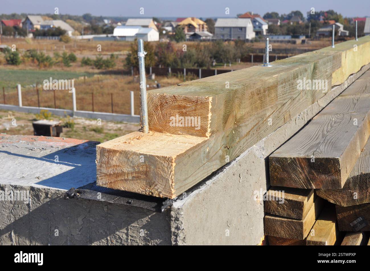 Close up on installed a wooden beam on a brick wall with waterproofing ...