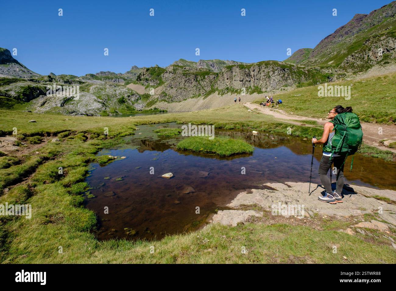 Hikers on Lac du Miey Stock Photo - Alamy