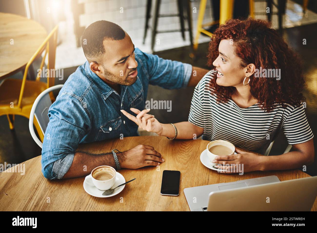 Couple, coffee and relax with talking at cafe for explaining ...