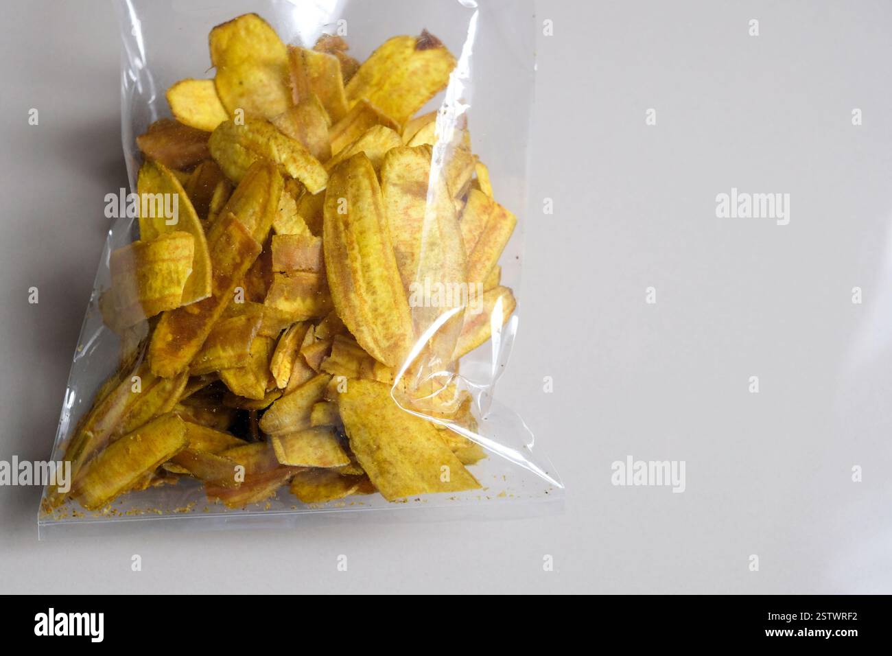 Close-up of banana chips in plastic packaging Stock Photo - Alamy