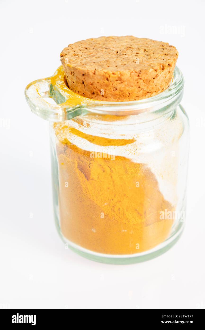 Ground turmeric in a glass jar Stock Photo - Alamy