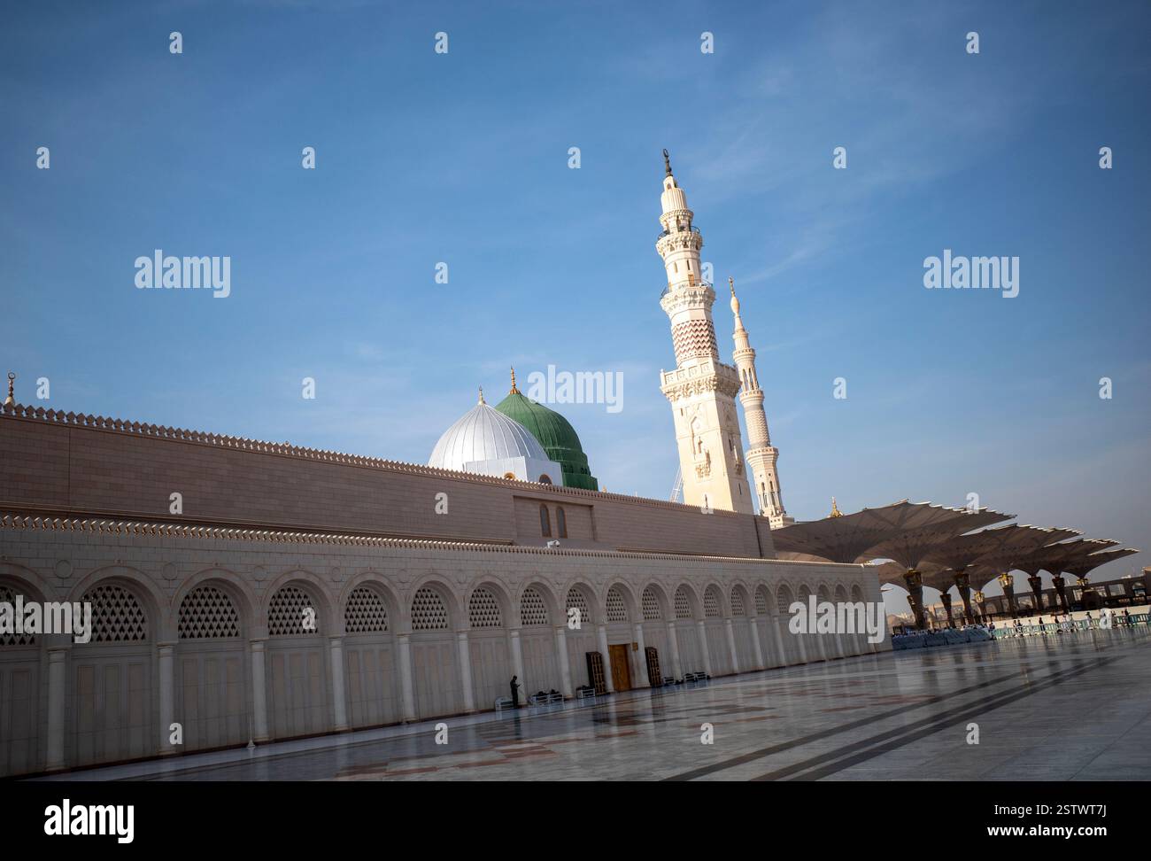 A green dome and minarets in Prophet Mosque in Madinah, also known as ...