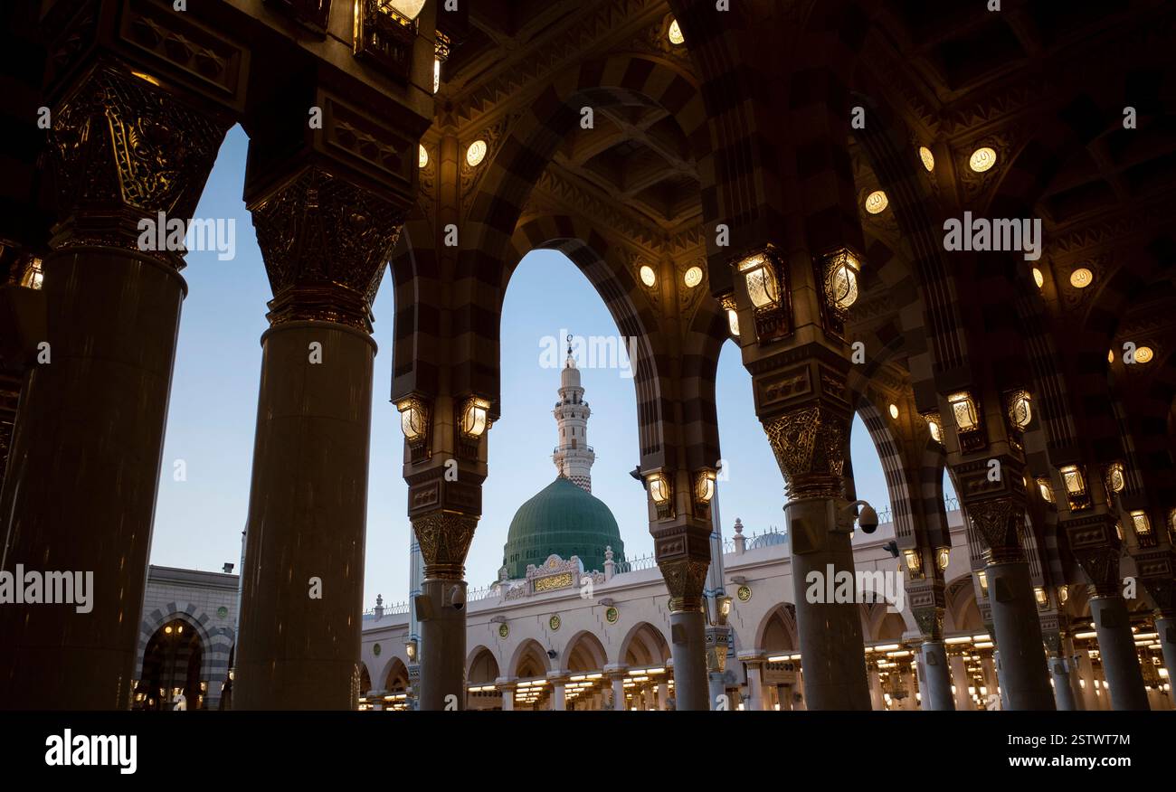 A green dome and minarets in Prophet Mosque in Madinah, also known as ...