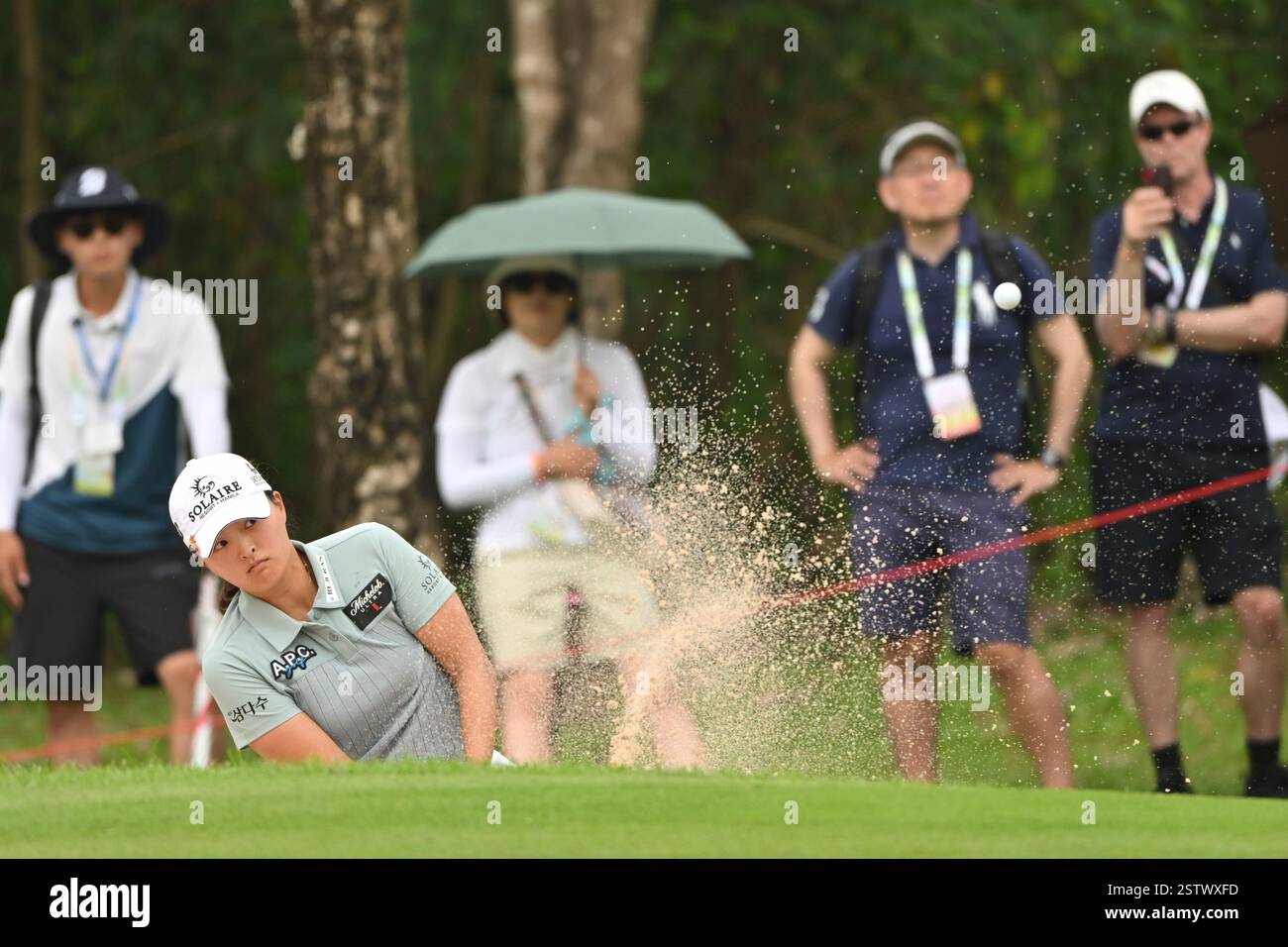 Jin Young Ko of South Korea hits out of a bunker on the 8th green during the first round of the ...