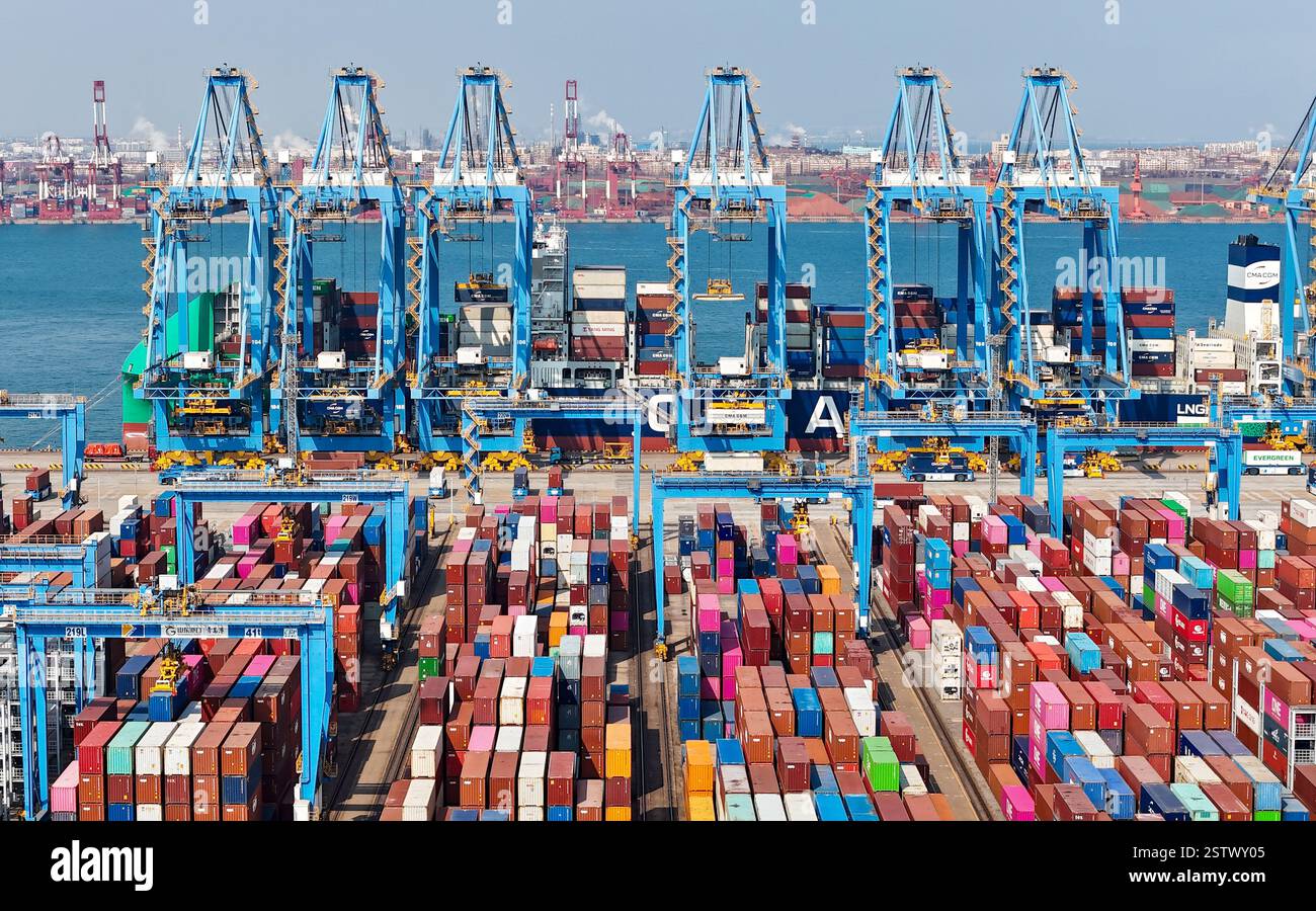 QINGDAO, CHINA - FEBRUARY 20, 2025 - A cargo ship loading and unloading ...