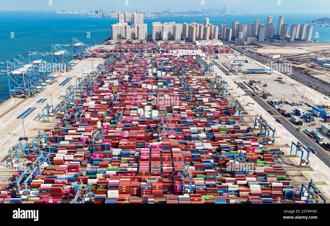 QINGDAO, CHINA - FEBRUARY 20, 2025 - High-speed rail cranes lift cargo ...