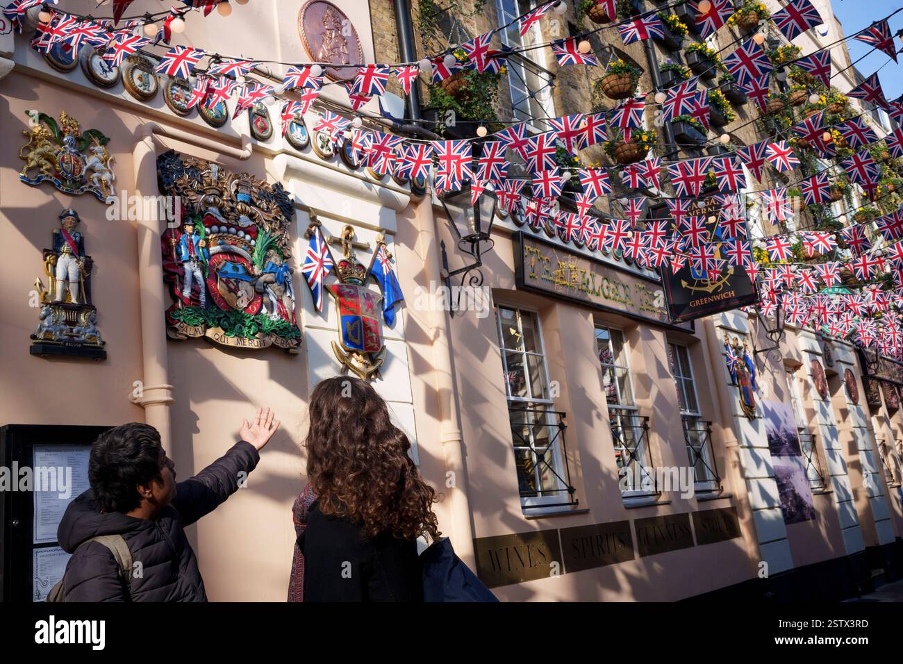 Union Jacks flags hang above Admiral Lord Nelson and coats of arms at ...