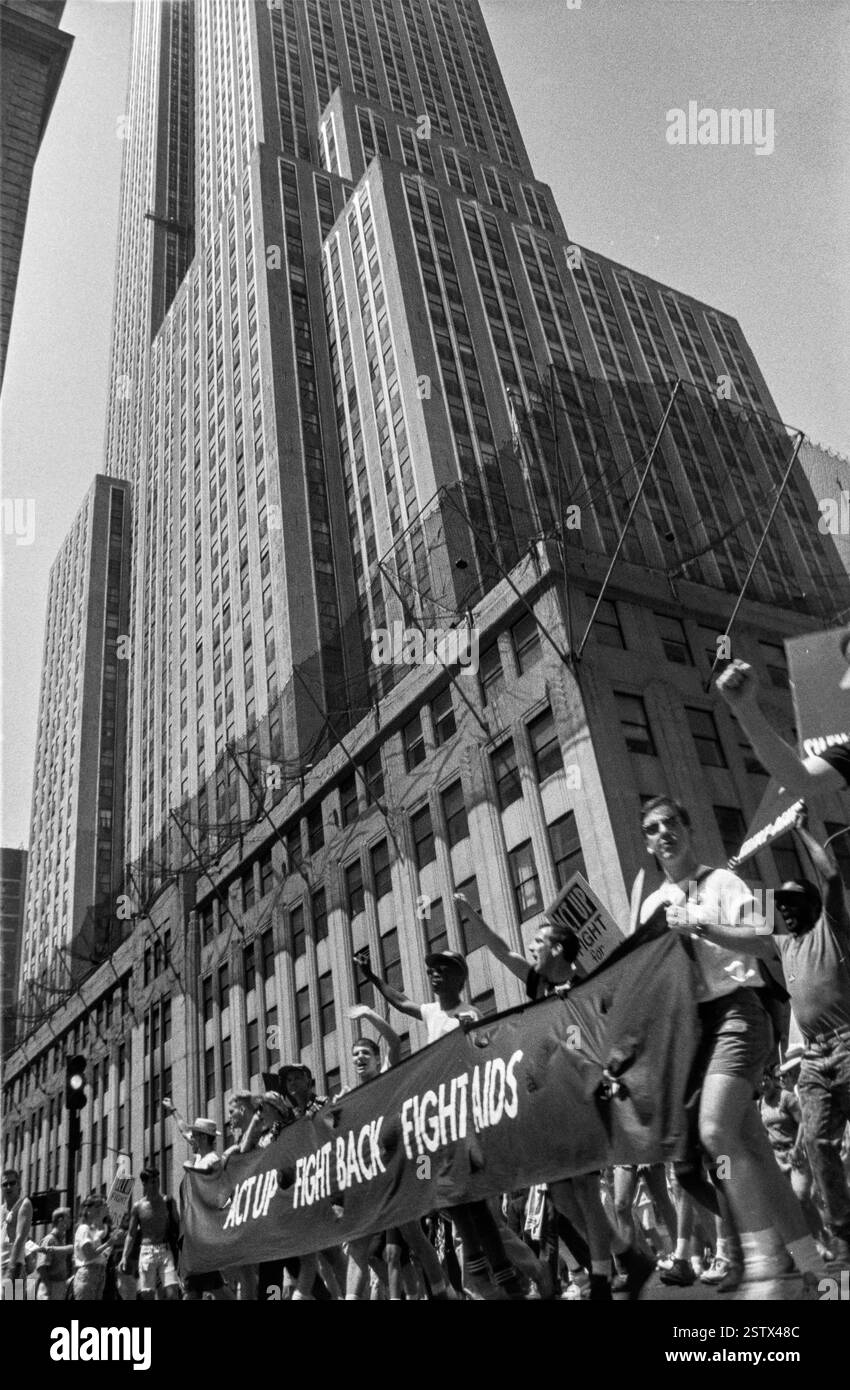 marchers presenting banner “ act up fight back fight AIDS“ during NYC ...