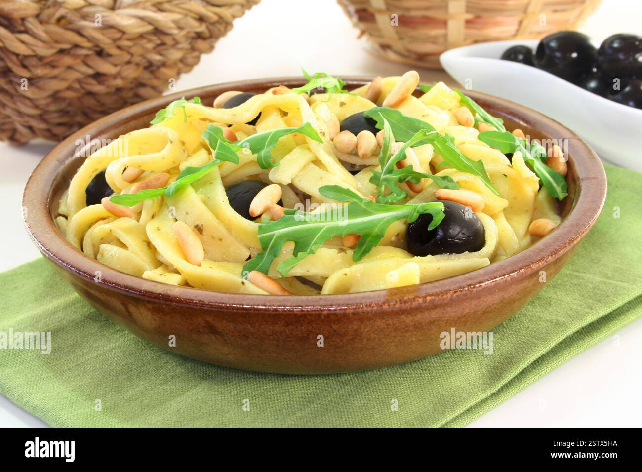 Ribbon noodles with rocket salad Stock Photo - Alamy