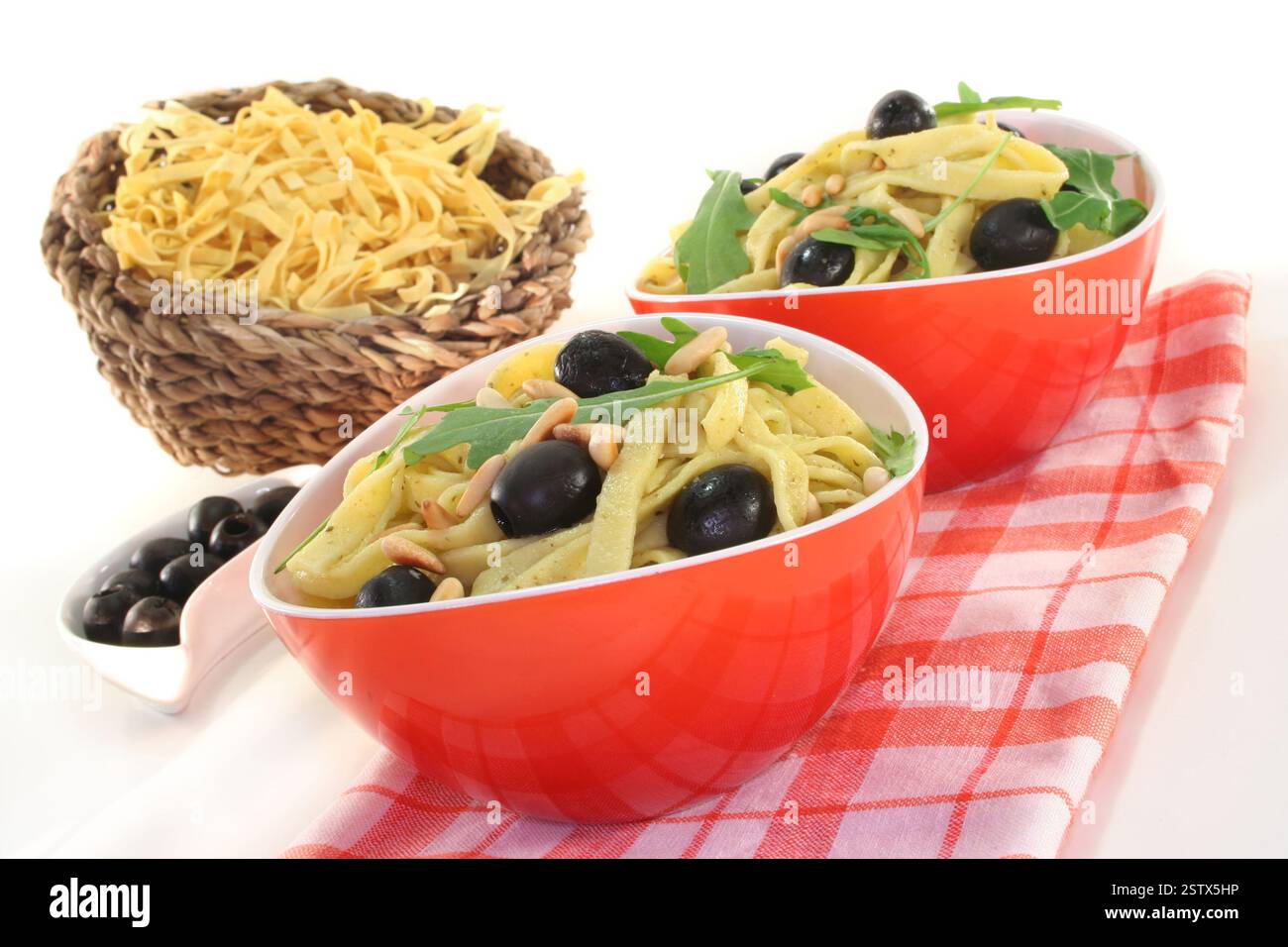 Ribbon noodles with rocket salad Stock Photo - Alamy