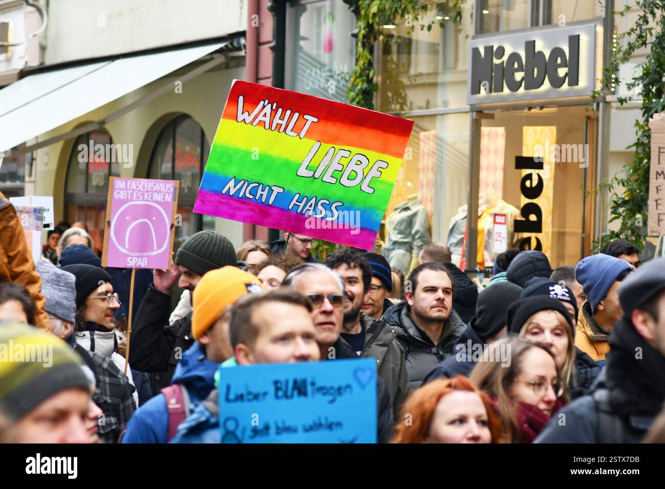 Heidelberg, Germany - February 12th 2025: Person holding up rainbow ...