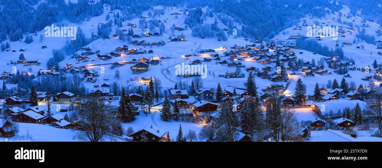 Panorama view of Grindelwald villages with wooden chalets covered with ...