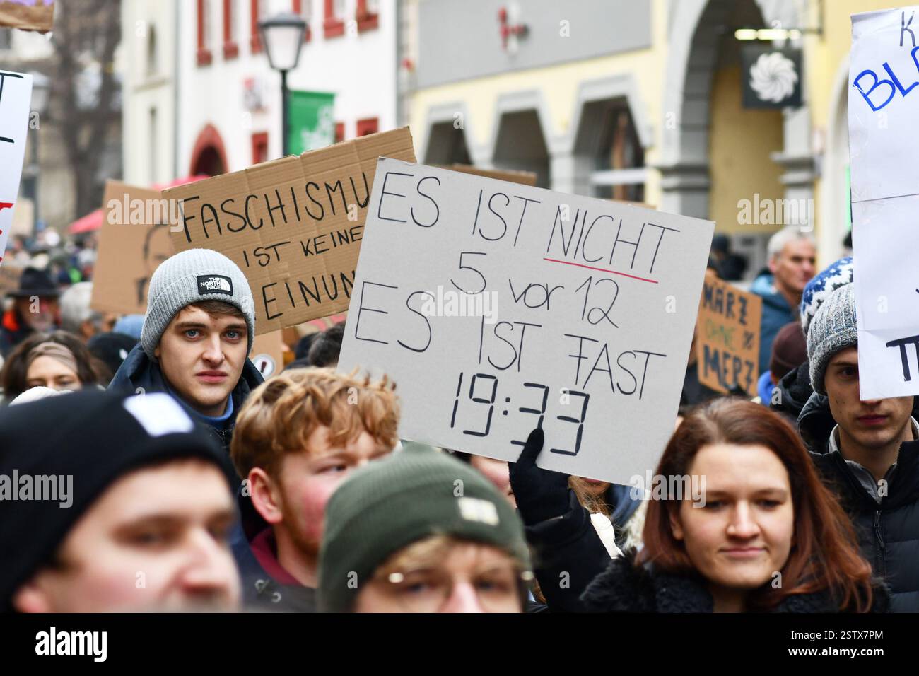 Heidelberg, Germany - February 12th 2025: People holding up signs in ...