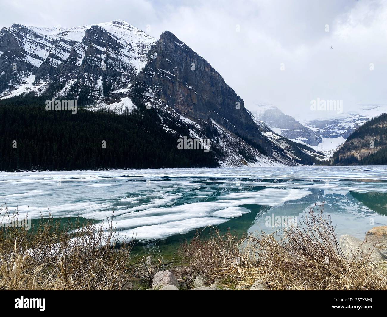 The image depicts a stunning natural landscape featuring a partially ...