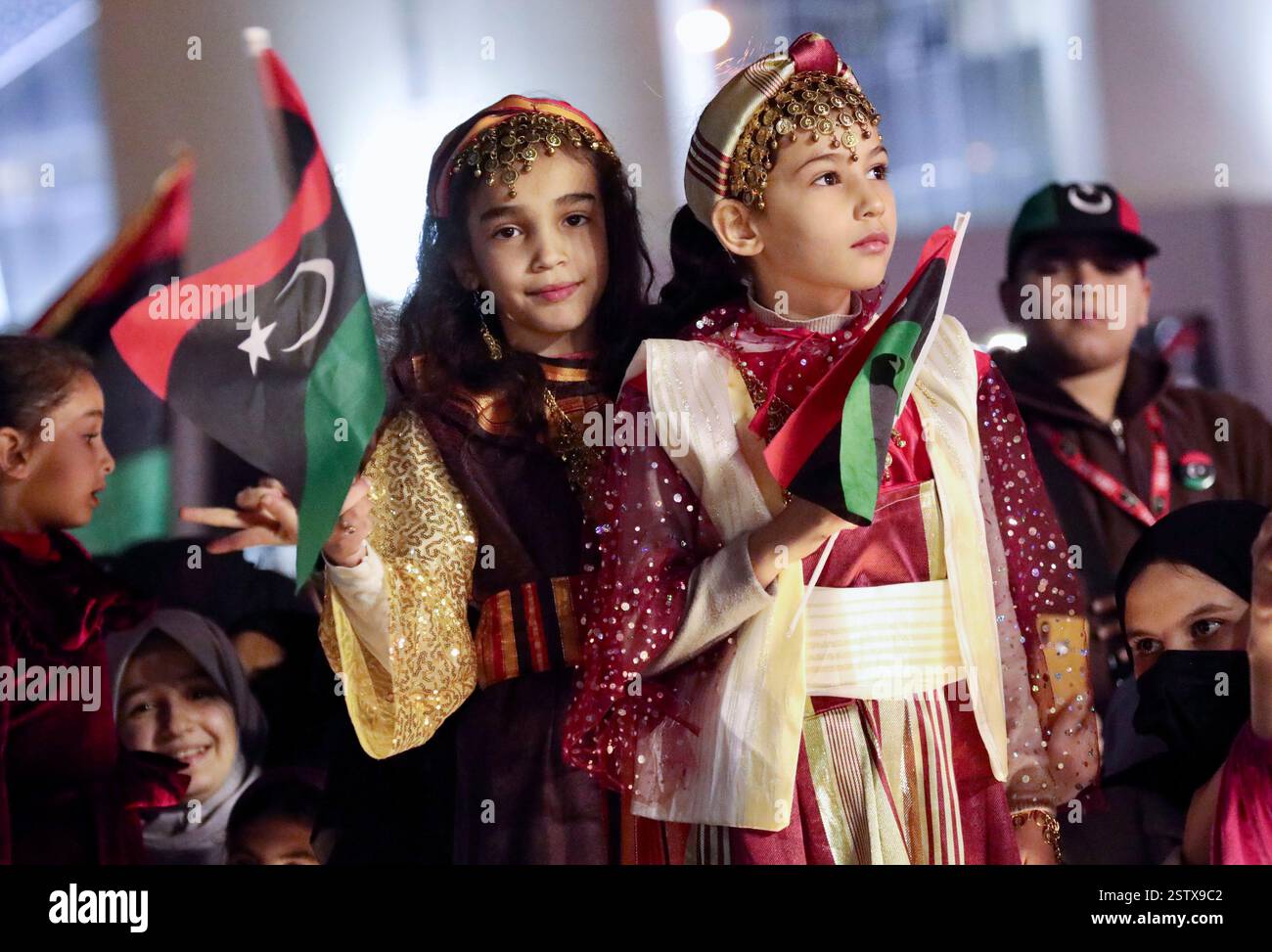 Libyans wave national flags as they celebrate the anniversary of the ...