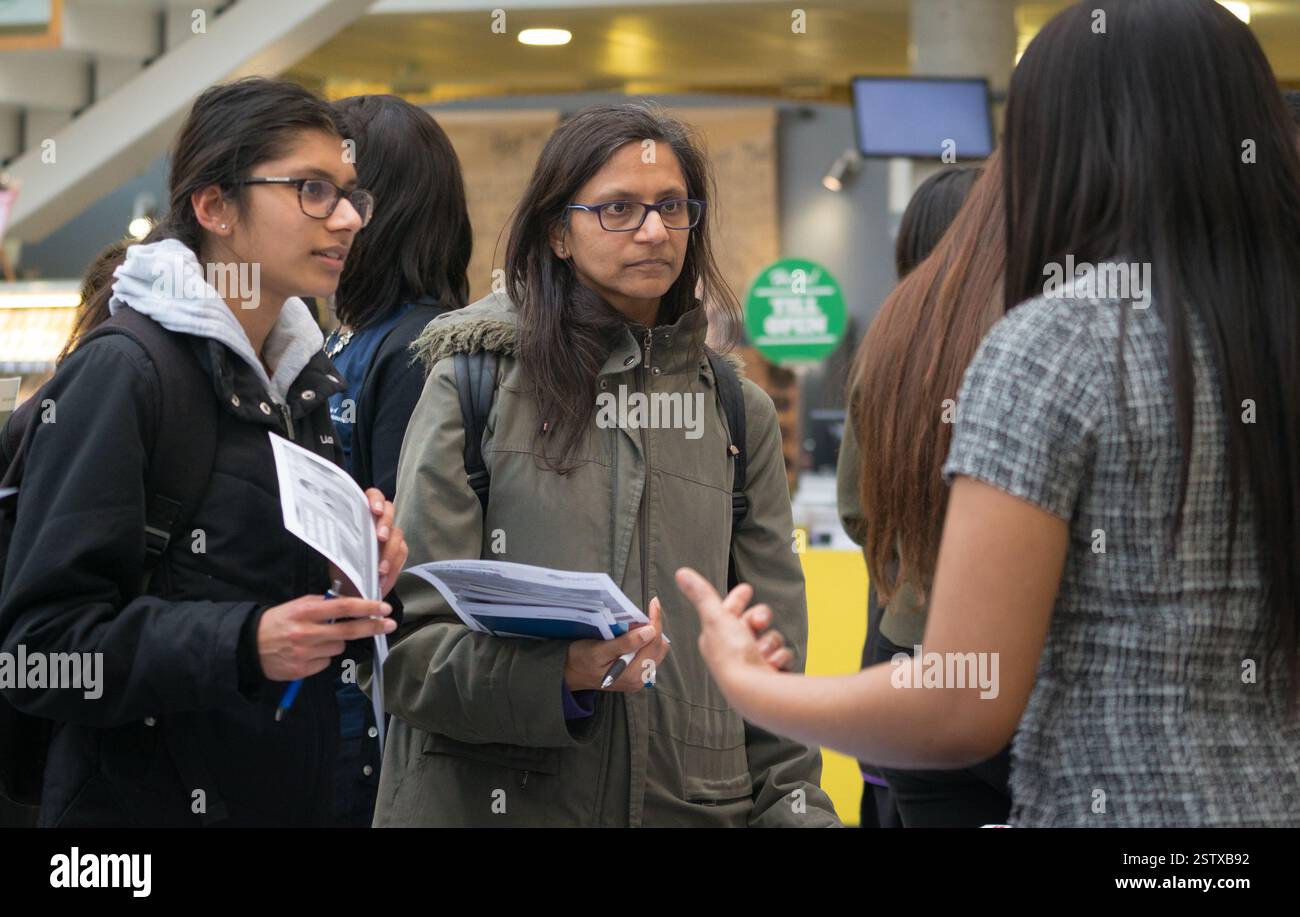 Careers event at Middlesex University with students interacting with staff Stock Photo - Alamy