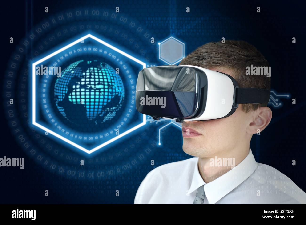 Young businessman with VR glasses on a digital earth interface ...