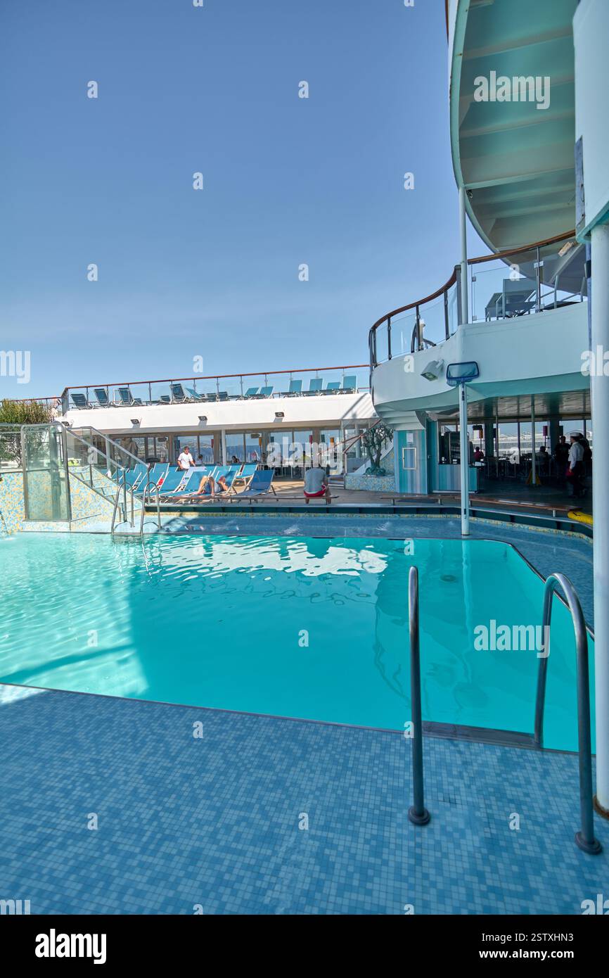 Catania. Italy - February 20, 2025: Relaxing day by the pool on a ...