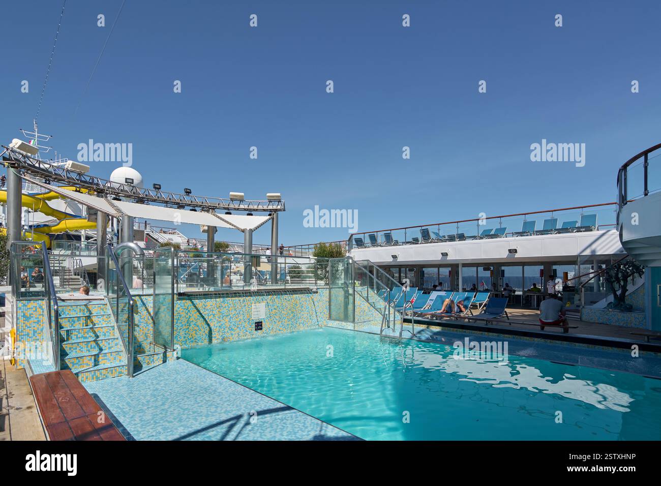 Catania. Italy - February 20, 2025: A sunny day on a cruise ship's pool ...