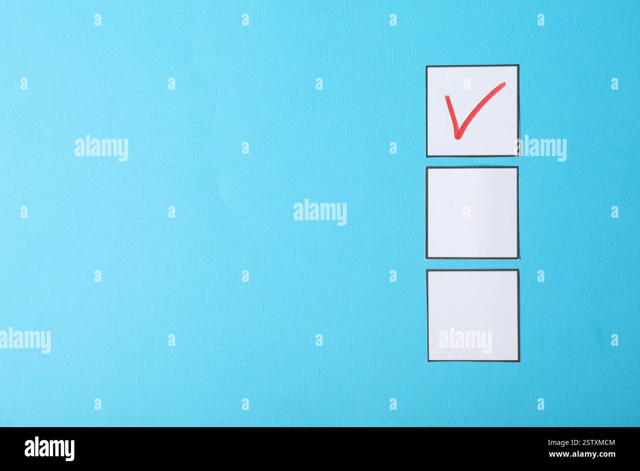 One checkbox with tick mark among others on light blue background, flat ...