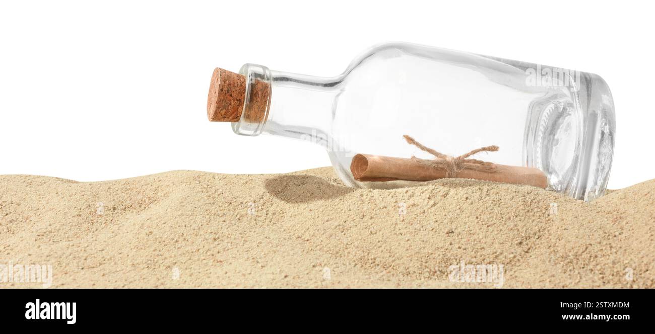 Rolled letter in corked glass bottle on sand against white background ...