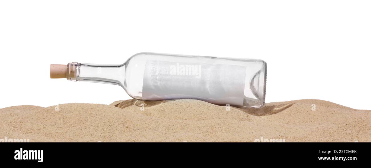 Rolled letter in corked glass bottle on sand against white background ...