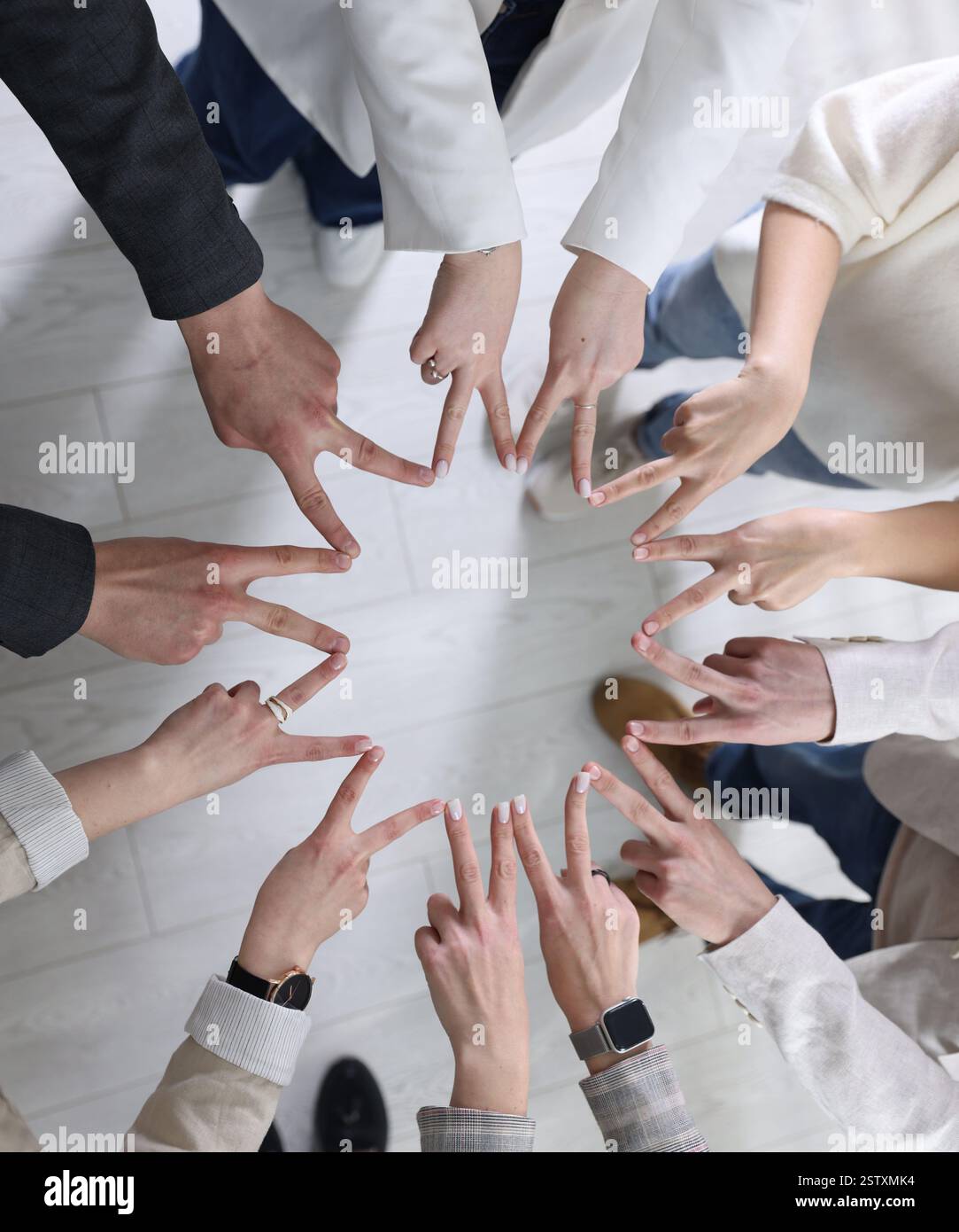 Unity concept. People showing V-sign with both hands and joining their ...