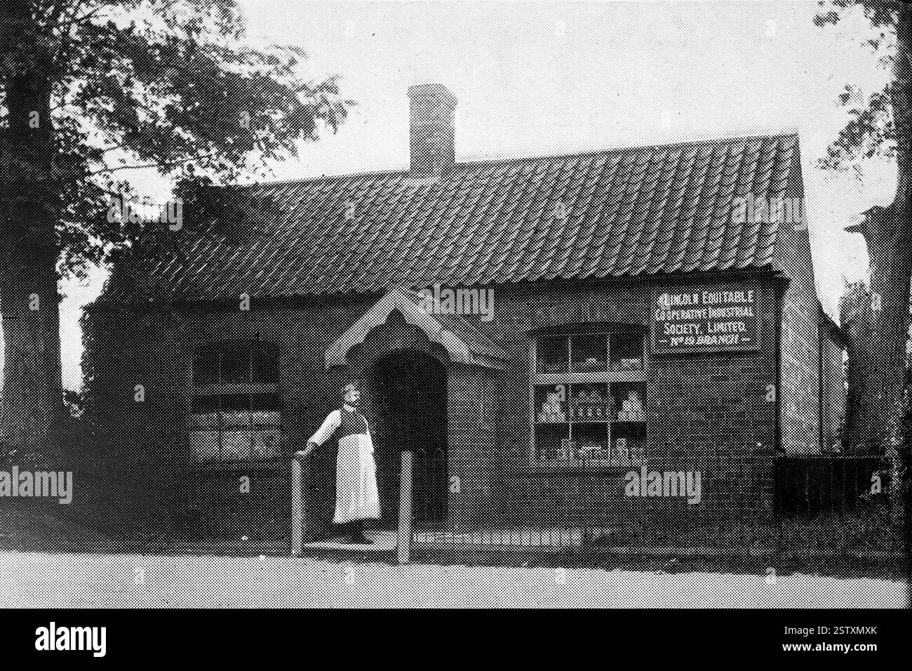 Shopfront and staff members of the No. 19 Branch, Hackthorn, Lincoln ...