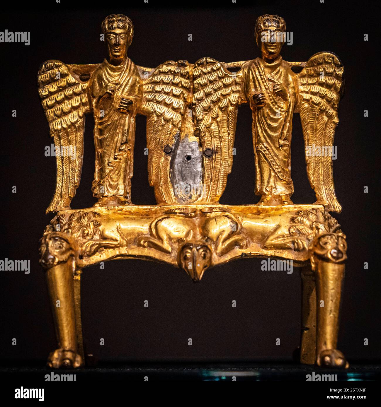 Support for a cross in the shape of two angels Stock Photo - Alamy
