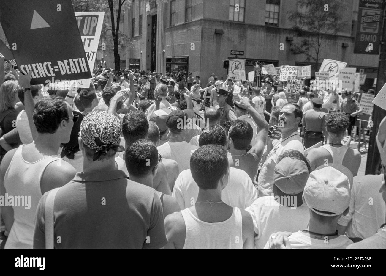 marchers clash with protesters holding up anti homosexual placards ...