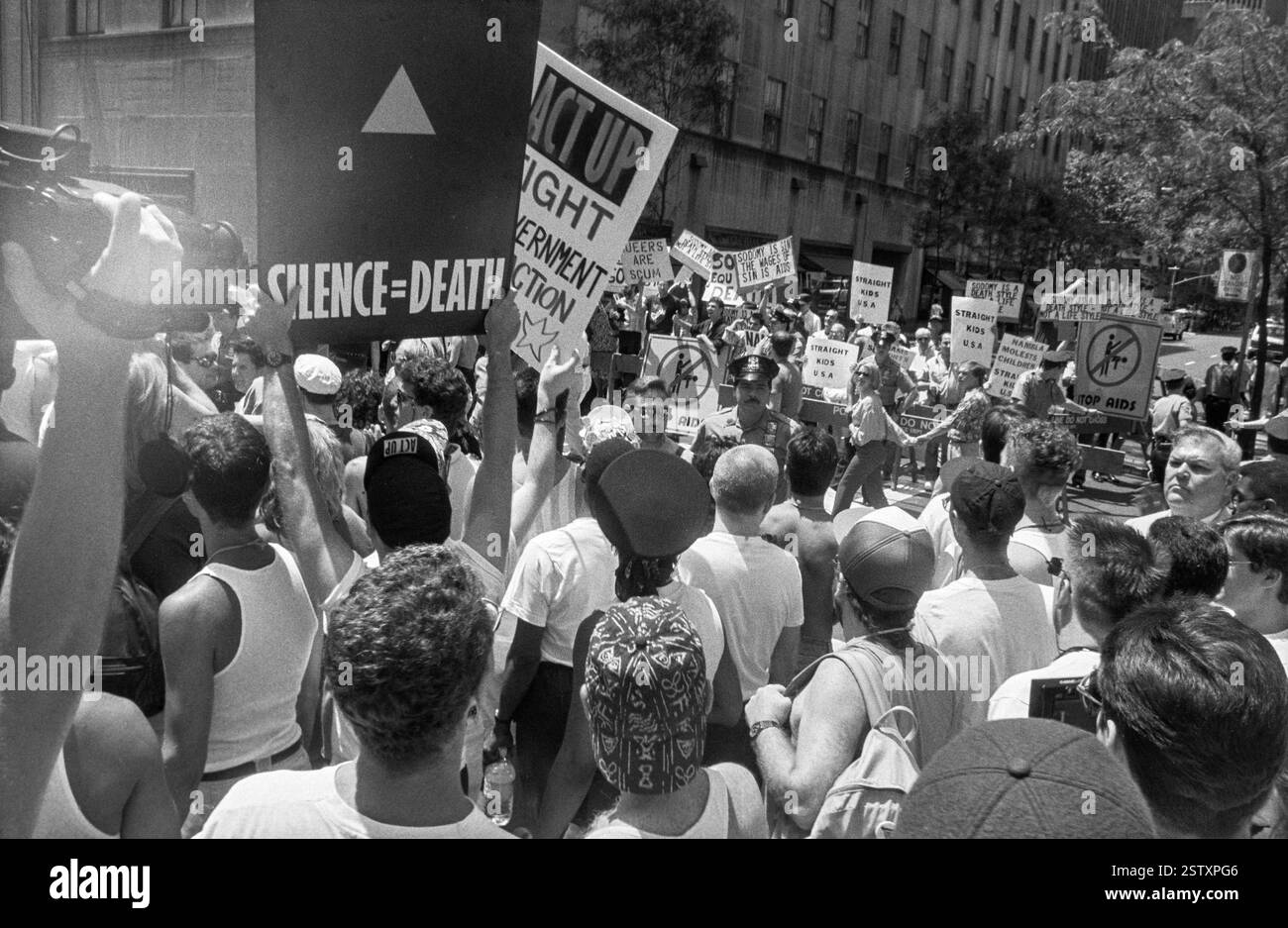 marchers clash with protesters holding up anti homosexual placards ...