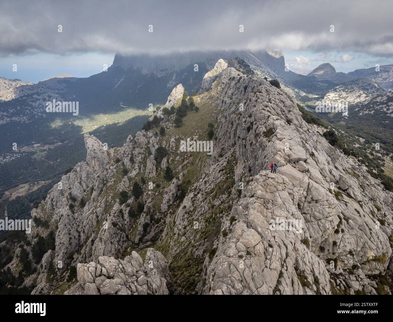 Mountaineers on the edge of Son Torrella sierra Stock Photo - Alamy