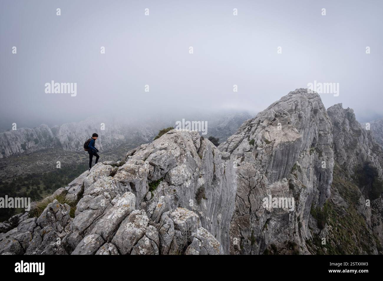 Lonely mountaineer on the edge of Son Torrella sierra Stock Photo - Alamy