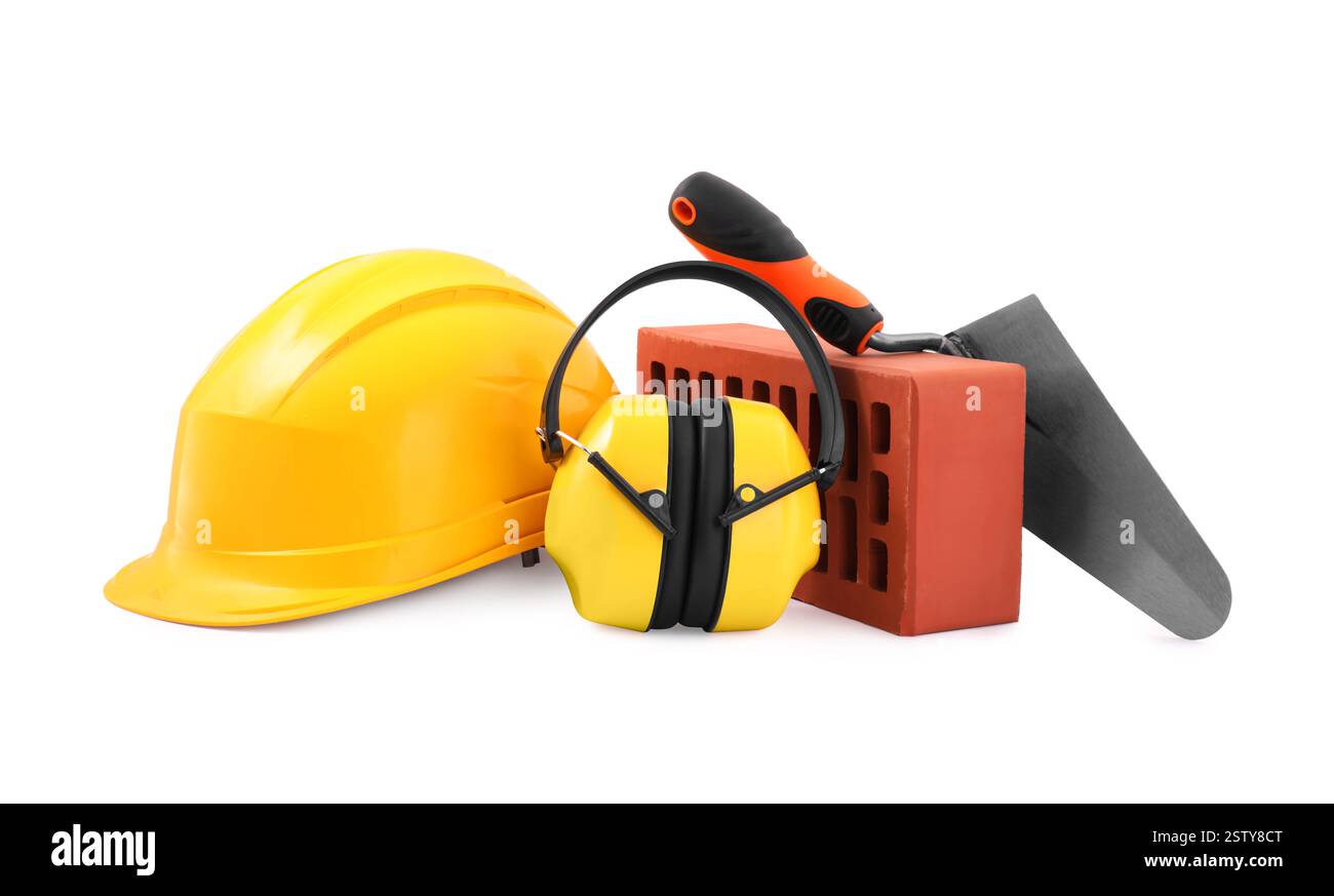 Protective equipment, brick and construction tool isolated on white ...