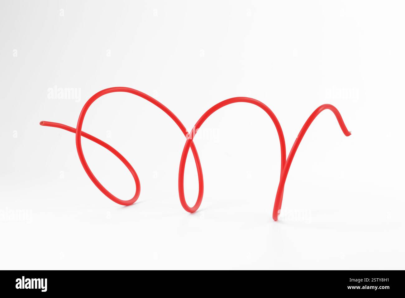 One red electrical wire isolated on white Stock Photo - Alamy