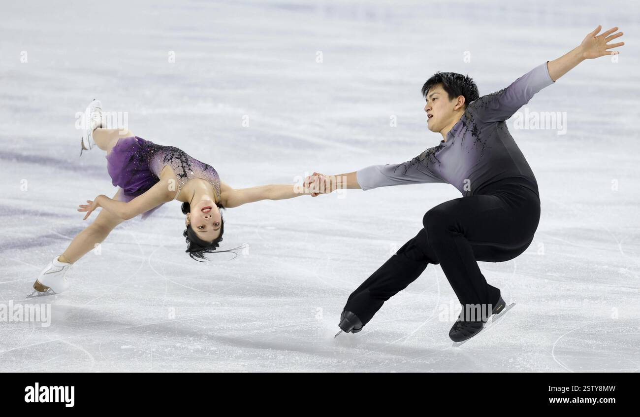 Riku Miura (L) and Ryuichi Kihara of Japan perform in the pairs short ...