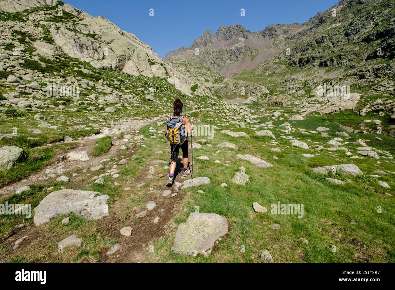 Hiker on ibones azules and bachimana alto route hi-res stock ...