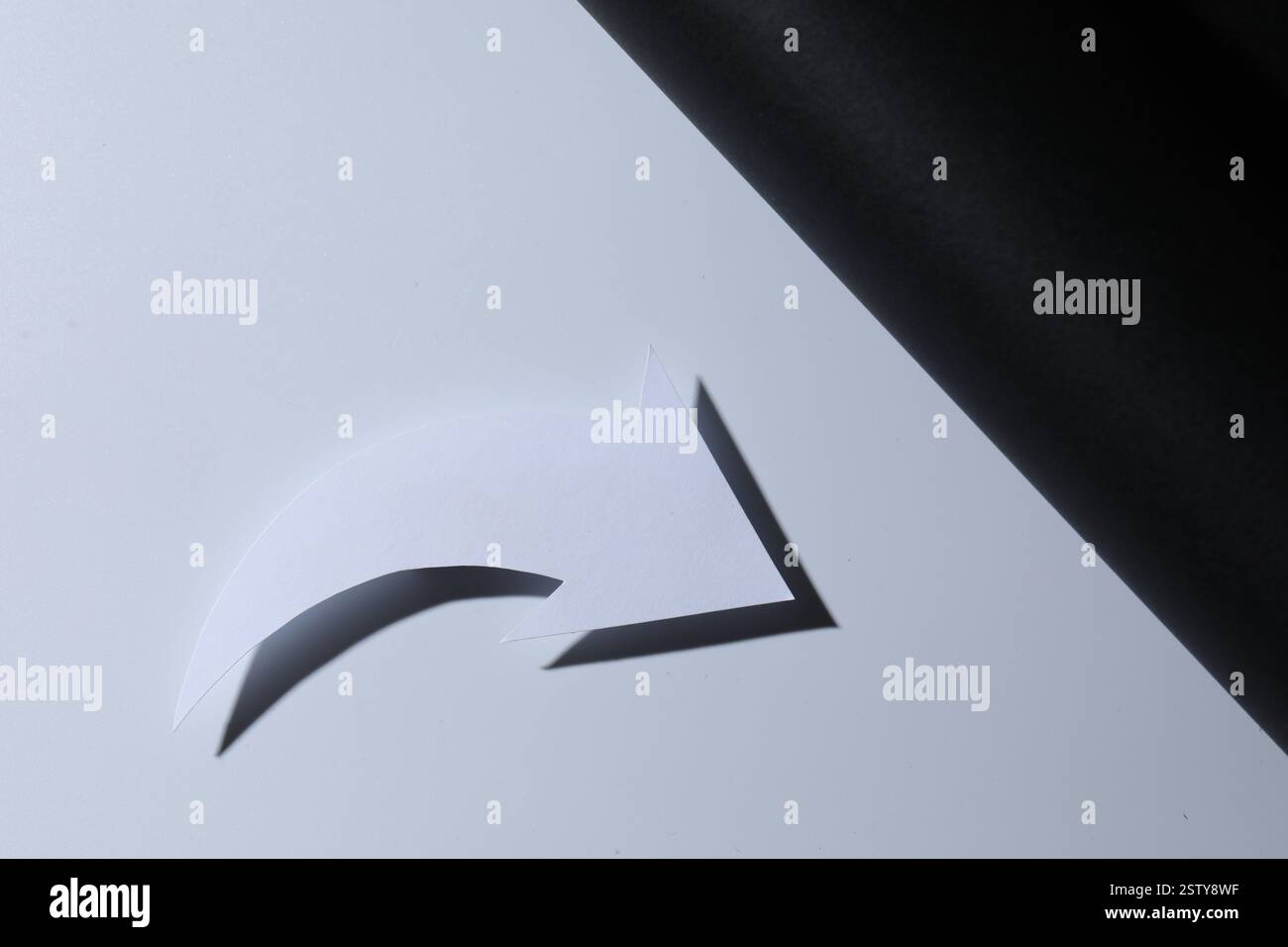 One white paper arrow on color background, top view Stock Photo - Alamy