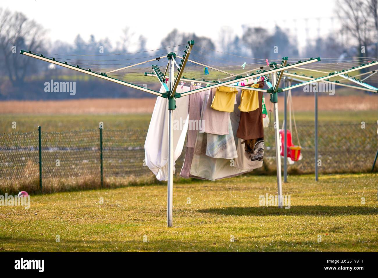 Bavaria, Germany - February 19, 2025: A rotary dryer in the garden with ...