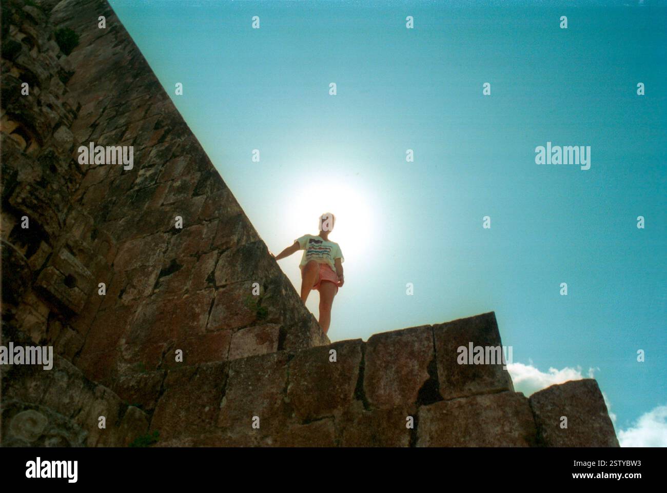 a chain serves as climbing support for the steep steps of The Pyramid of the Magician (Spanish ...