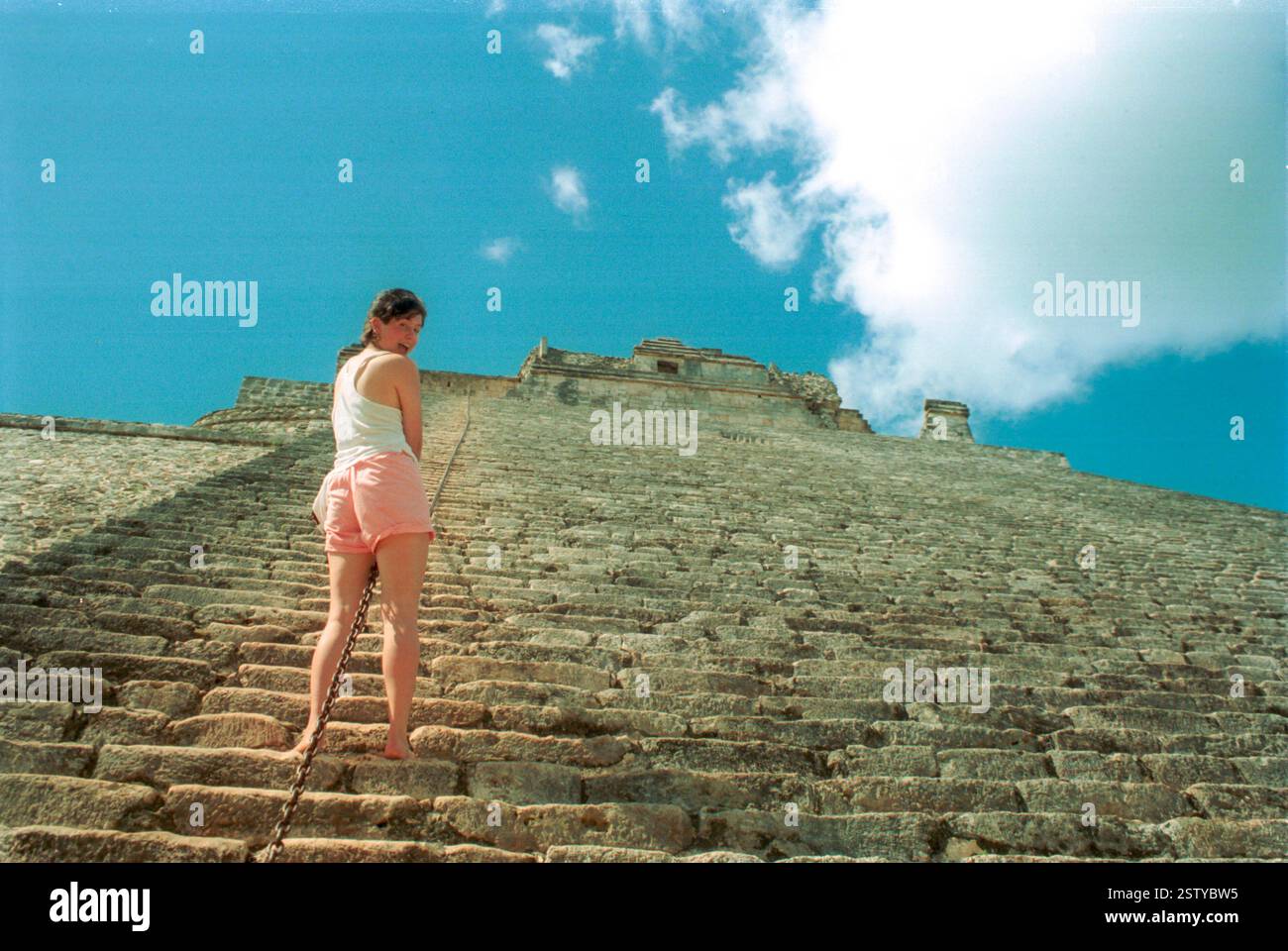 a chain serves as climbing support for the steep steps of The Pyramid of the Magician (Spanish ...