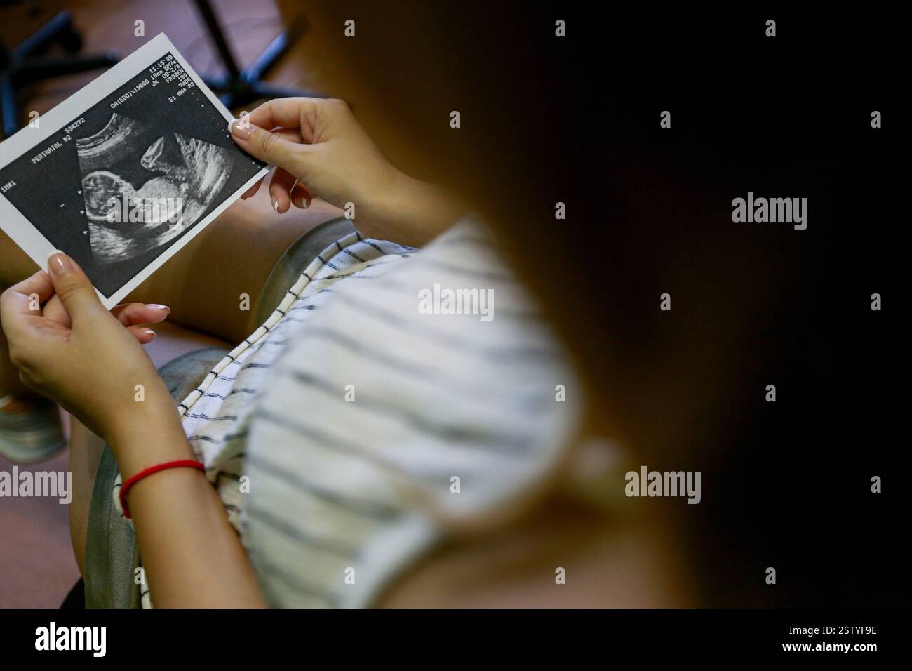 Gynecologist check. Pregnant belly with ultrasound result picture ...