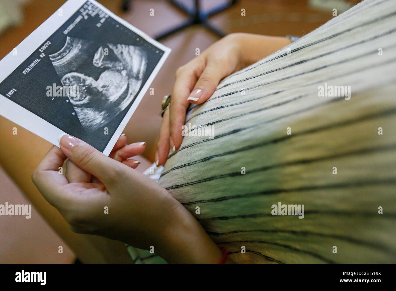 Gynecologist check. Pregnant belly with ultrasound result picture ...