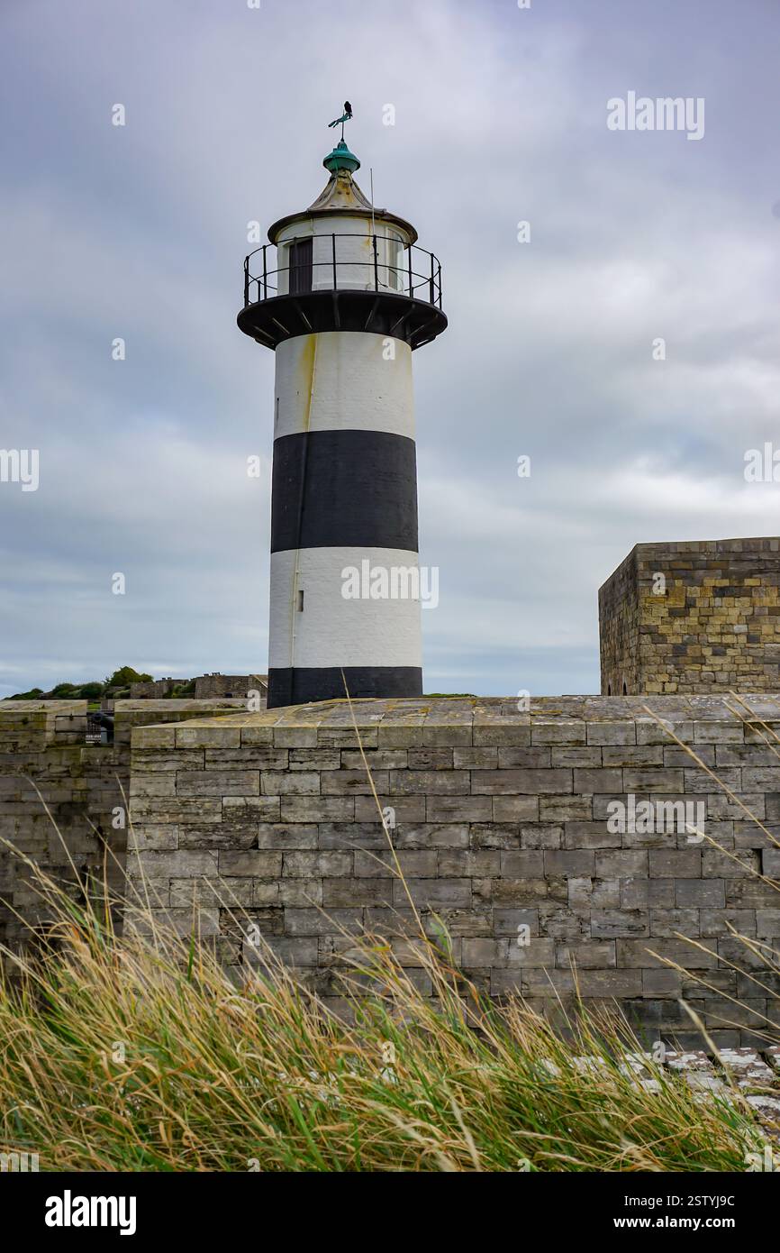 Old lighthouse building on the coast of England. Coastal landmarks ...