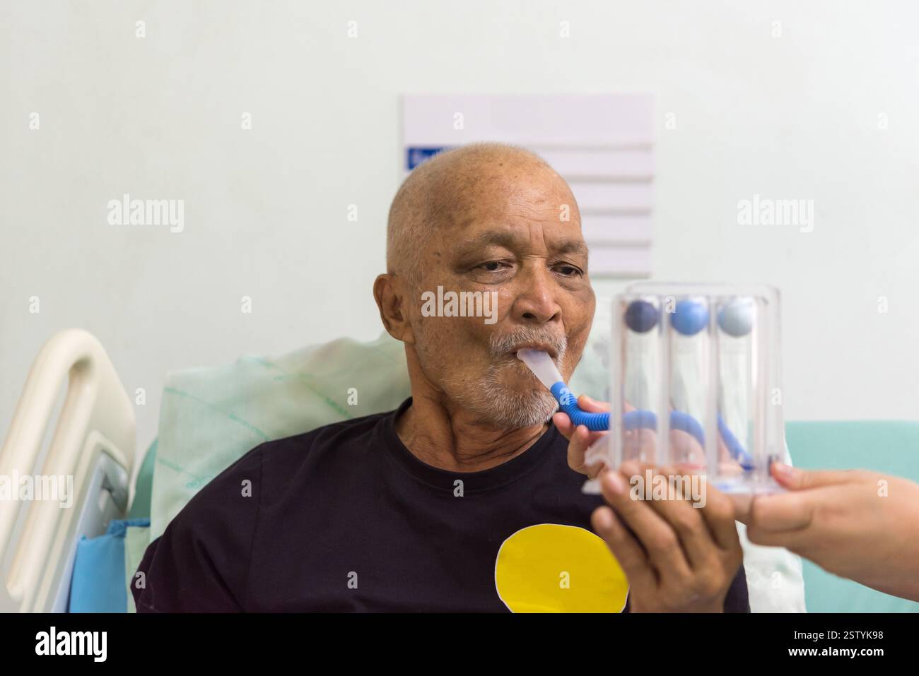 Patient asian elder man 70s use Incentive Spirometer or Triball Tri ...