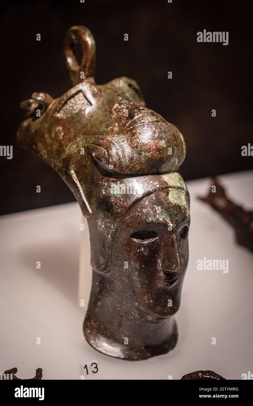 Bronze parades with the head of a warrior with a wolf head headdress ...