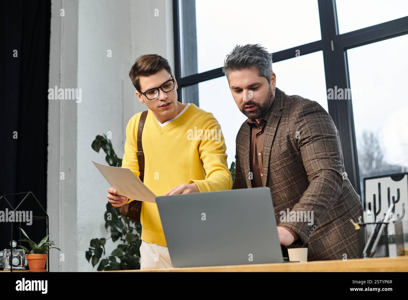 New employee receives guidance on first day at work in a bright and ...