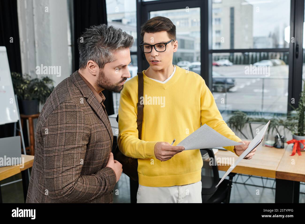 A new employee discusses job responsibilities with a seasoned colleague ...