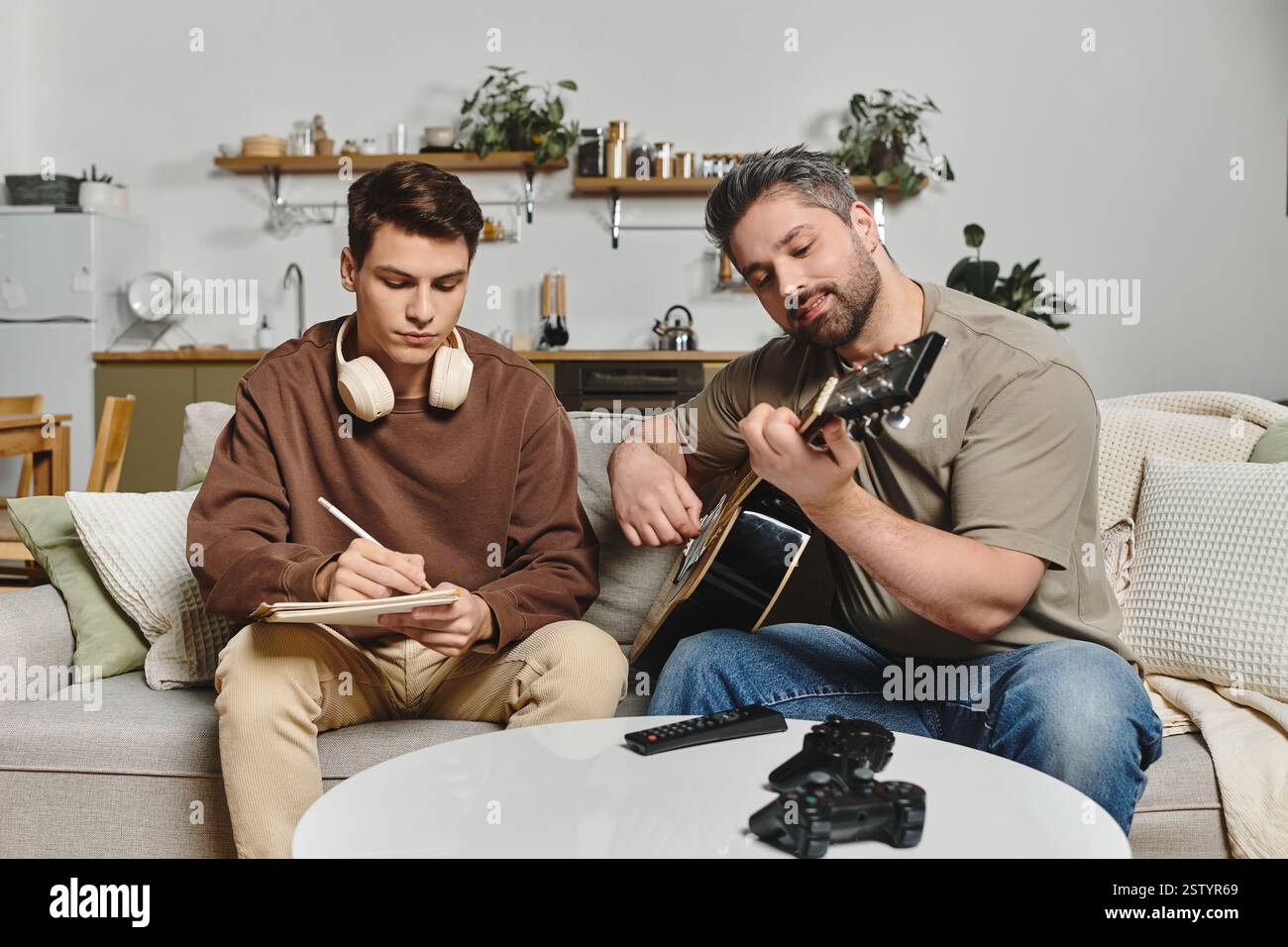 Two brothers share a warm moment while creating music and capturing ...